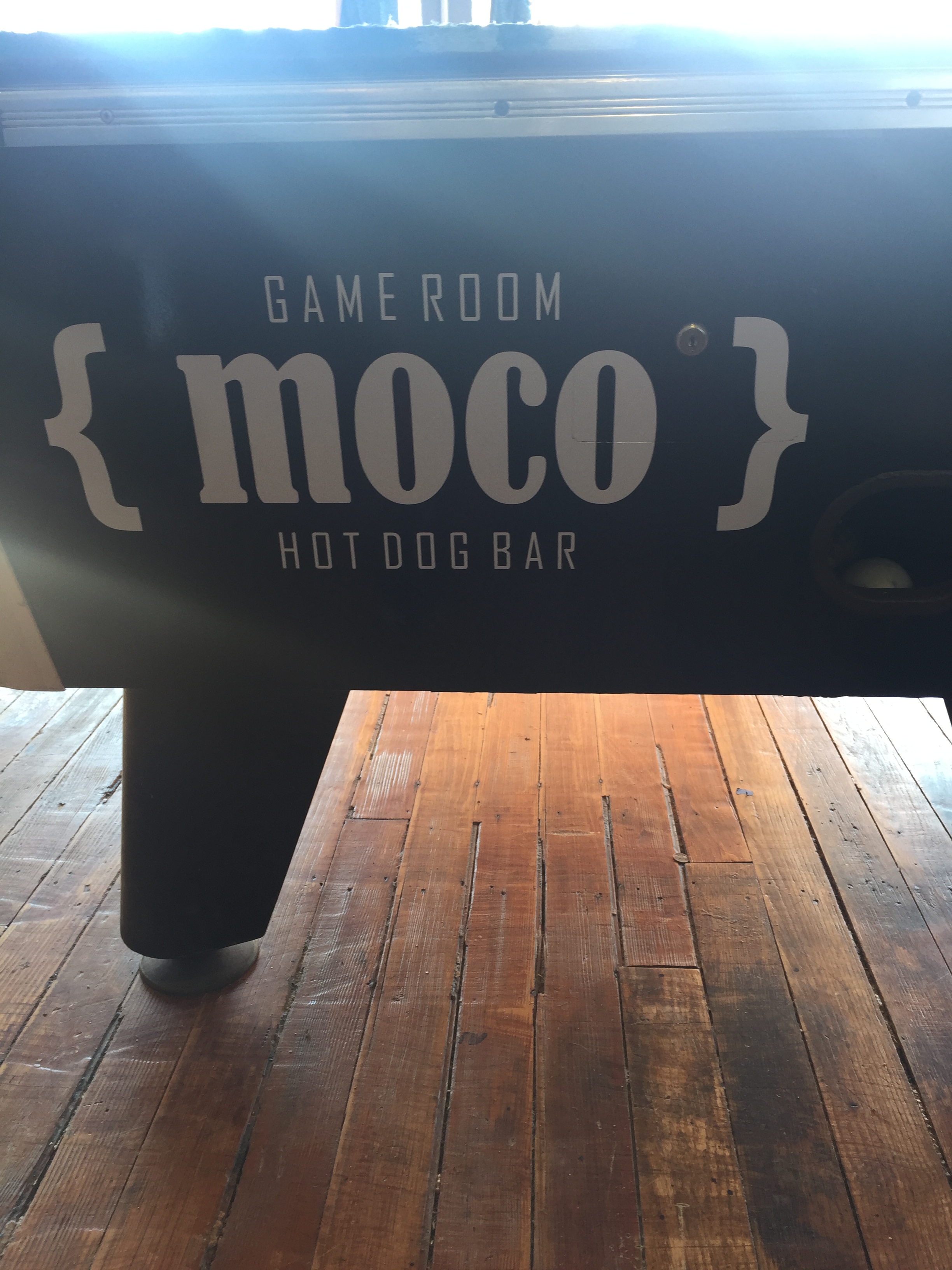 Moco Game Room + Hot Dog Bar brings new meaning to having a Beer + a Dog